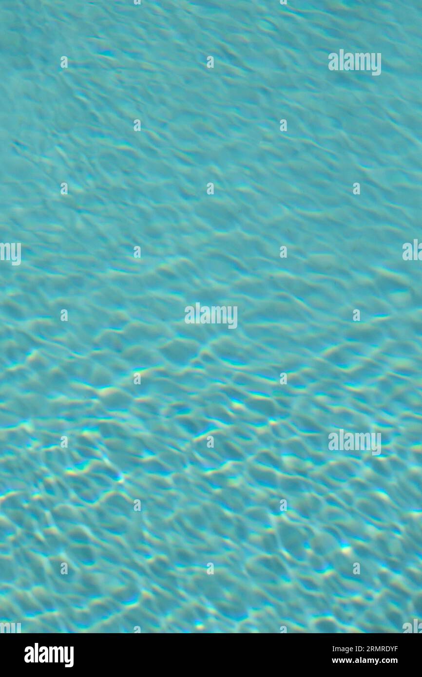 Indistinct Ripple refractions in a light blue pool Stock Photo - Alamy
