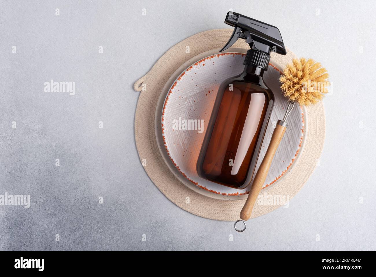 Recyclable spray bottle, dish brush and plates as concept for eco ...