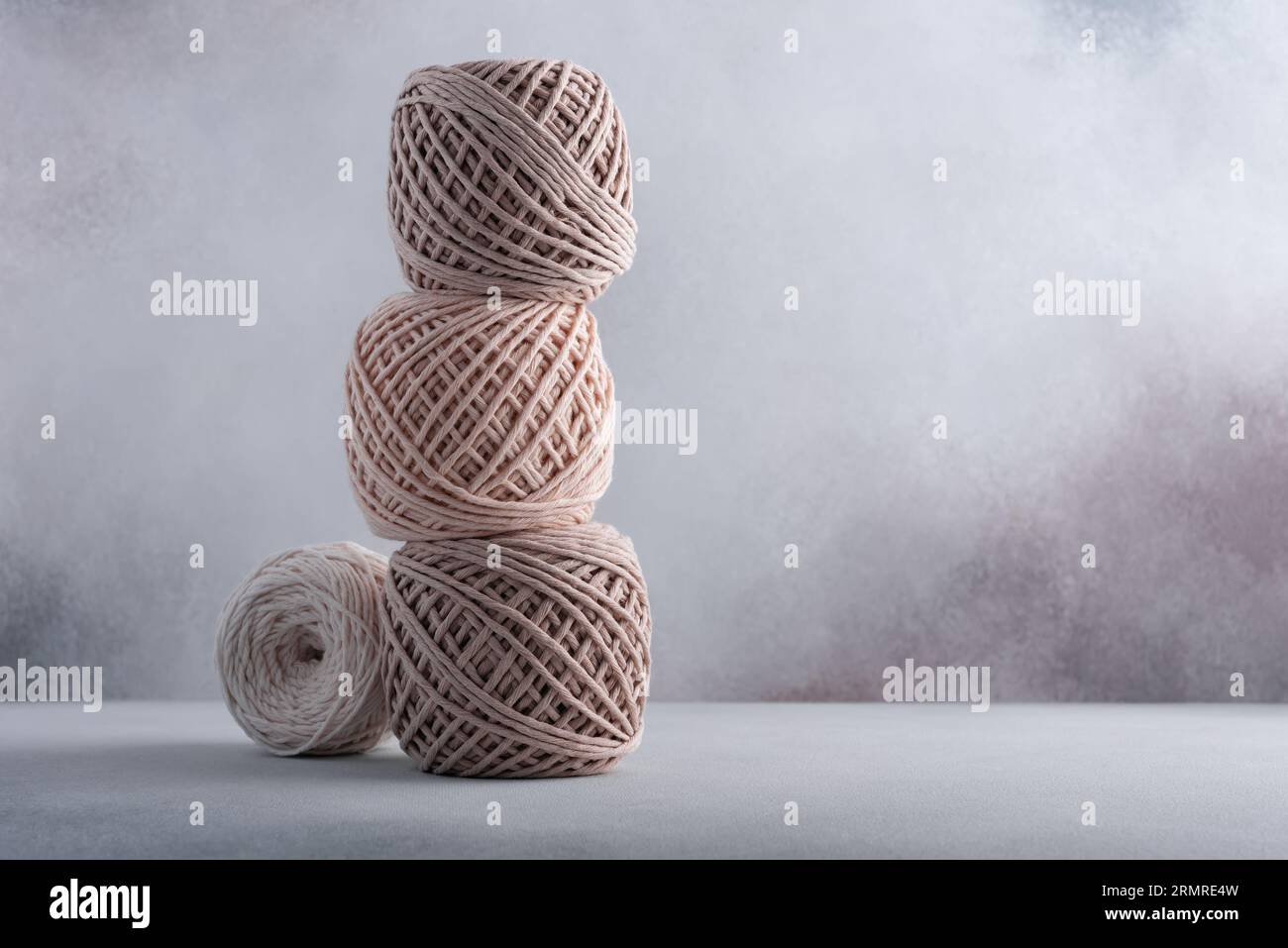 Stack of cotton threads pastel color skeins for craft and handmade on a ...