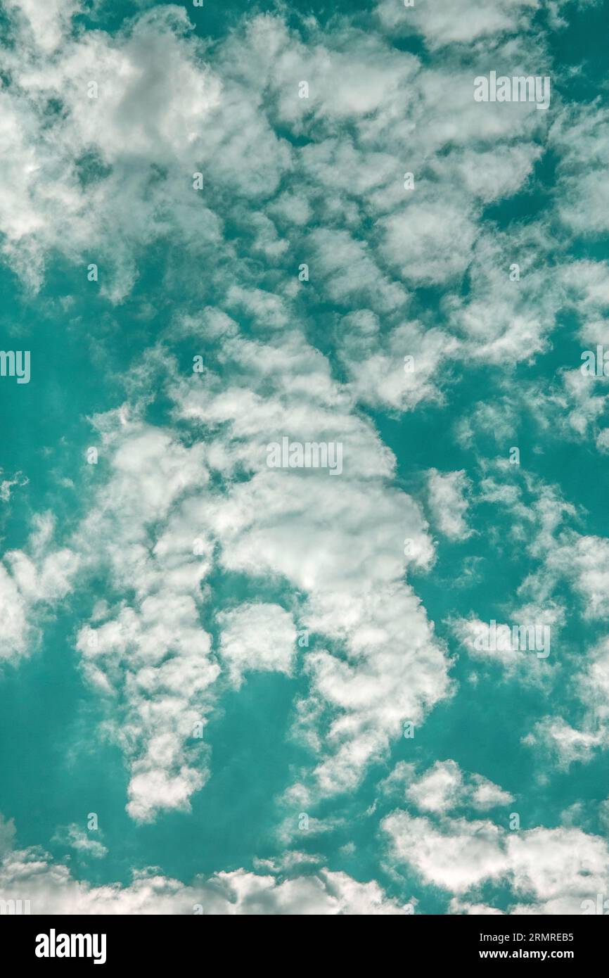 Clouds against a turqoise sky - background image Stock Photo - Alamy