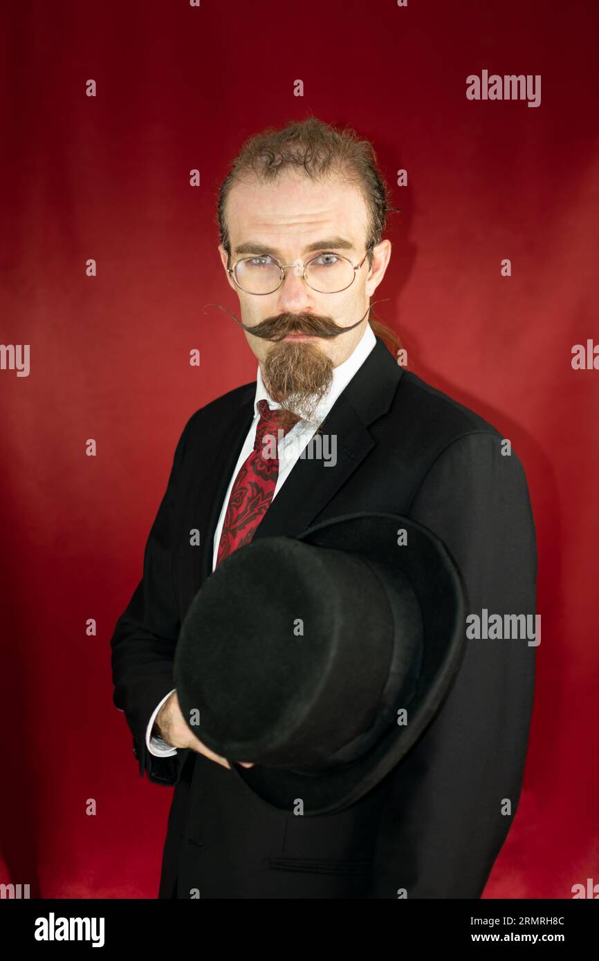 Vintage Caucasian Magician with top hat, glasses and mustache posing ...