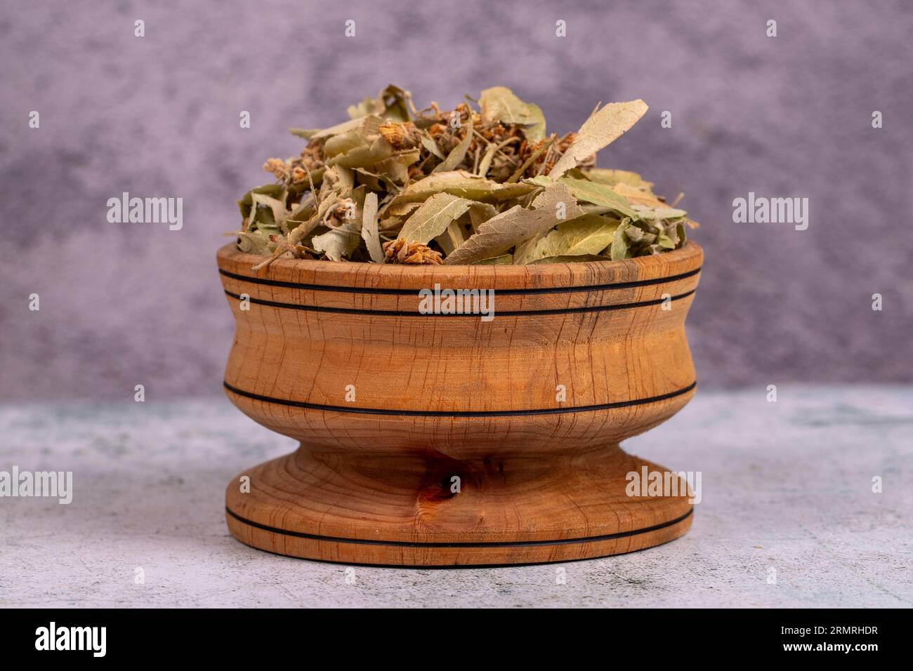 Dried linden flowers. Fresh flowers and leaves of linden in wood bowl ...