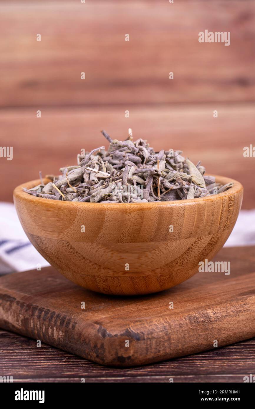 Dry Sage leaves. Dried salvia or sage leaves in wood bowl. herbal medicine. Close up Stock Photo ...