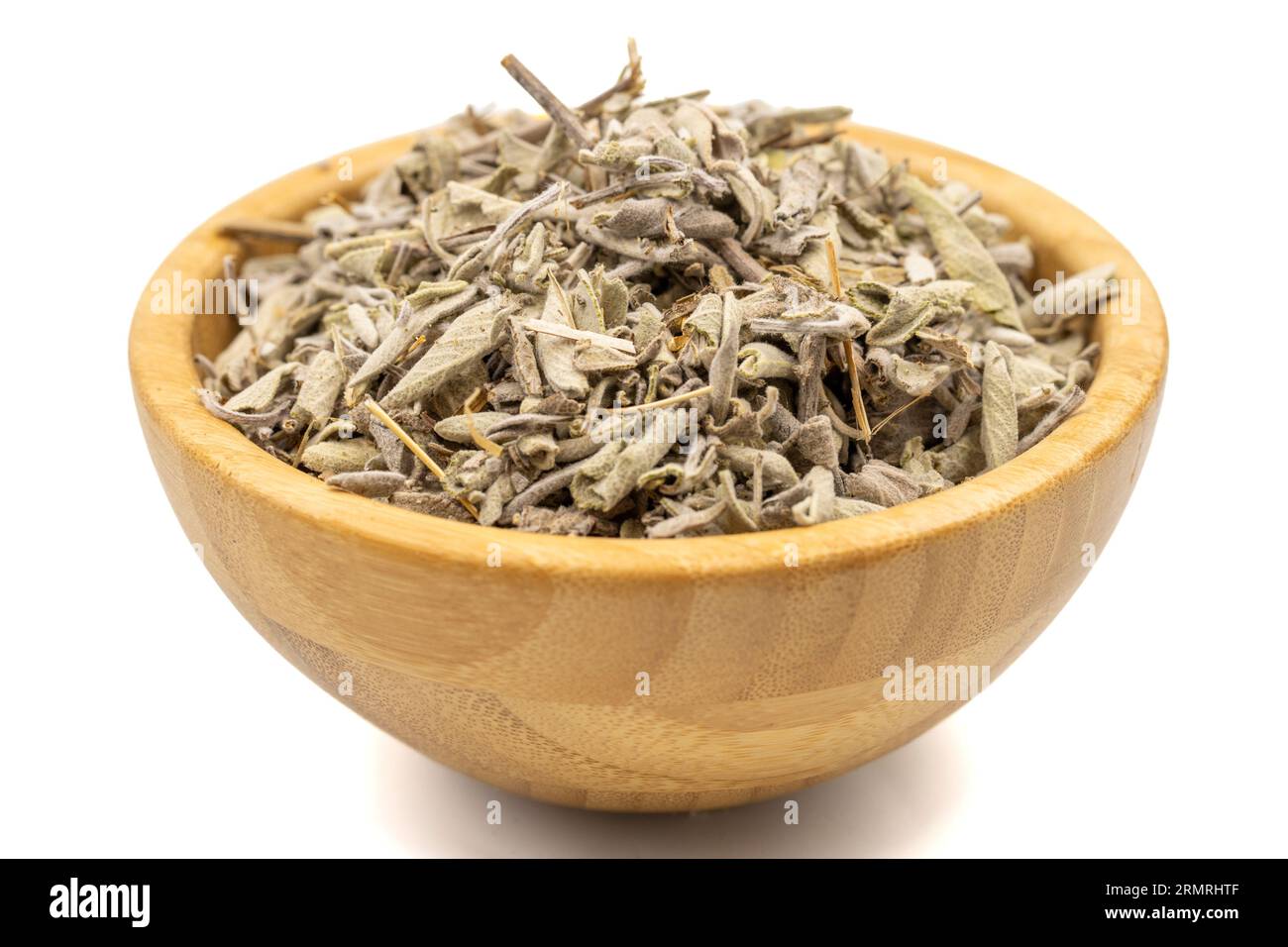 Dry Sage leaves. Dried salvia or sage leaves in wood bowl isolated on white background. herbal ...