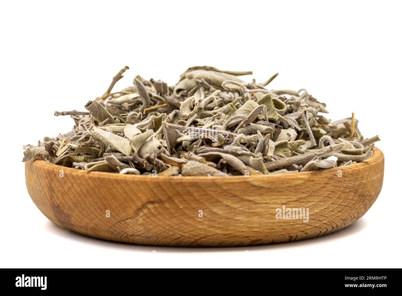 Dry Sage leaves. Dried salvia or sage leaves in wood bowl isolated on white background. herbal ...