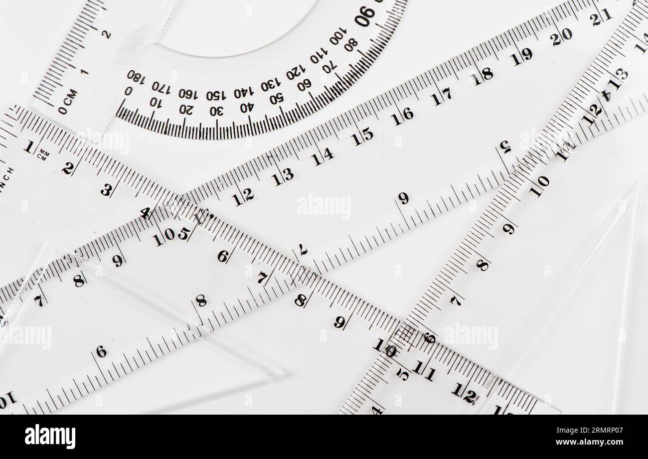 school background with set of transparent rulers on white background ...