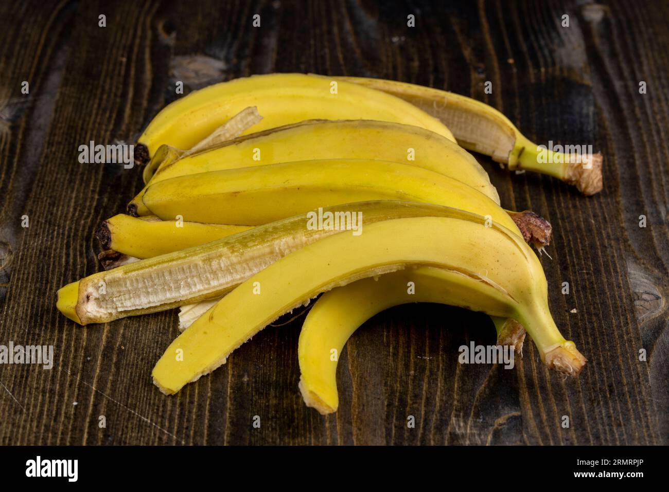 discarded yellow banana peel after picking fruits and banana pulp ...
