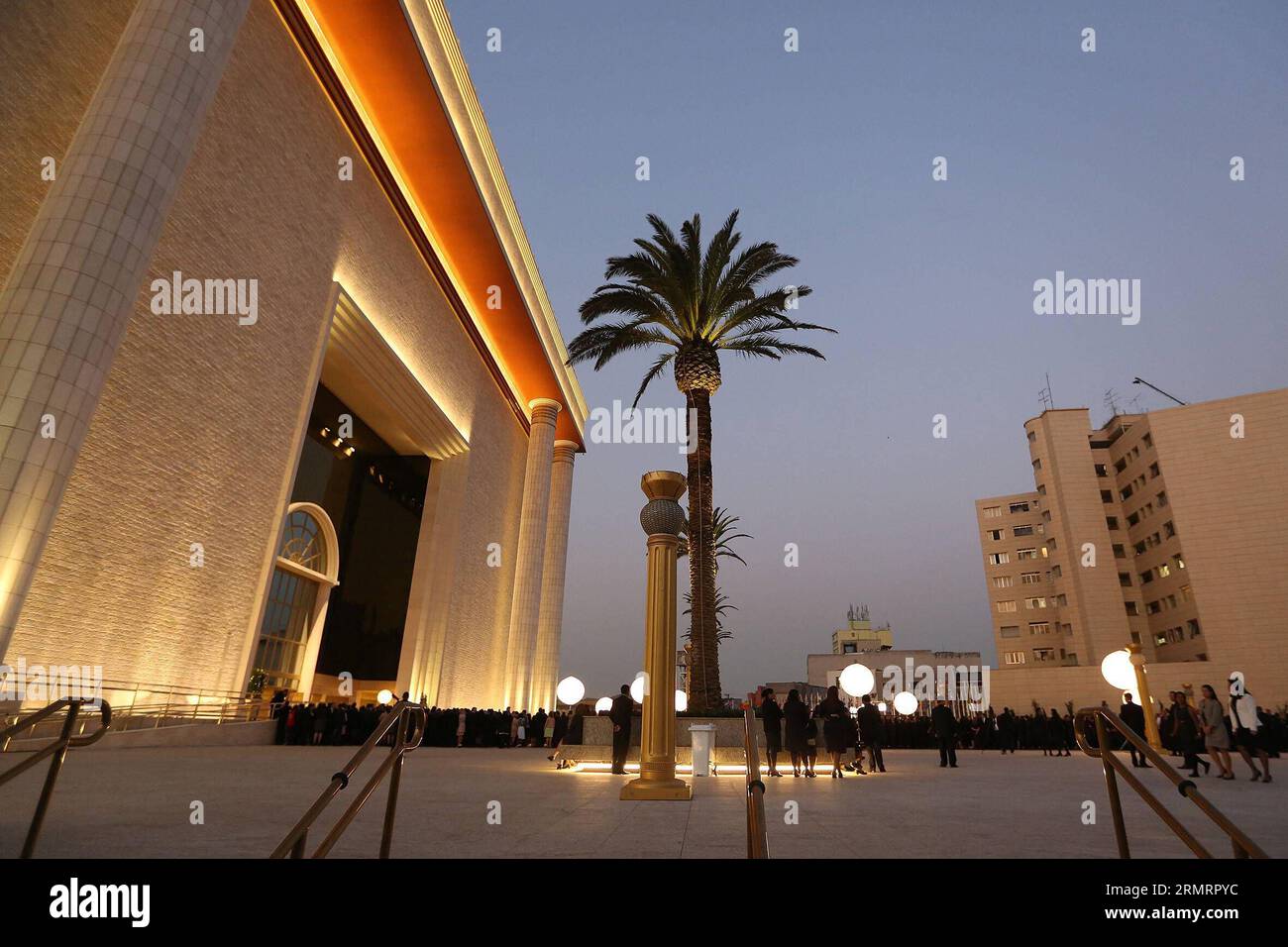 People stand in front of the Universal Church, prior to its opening in ...