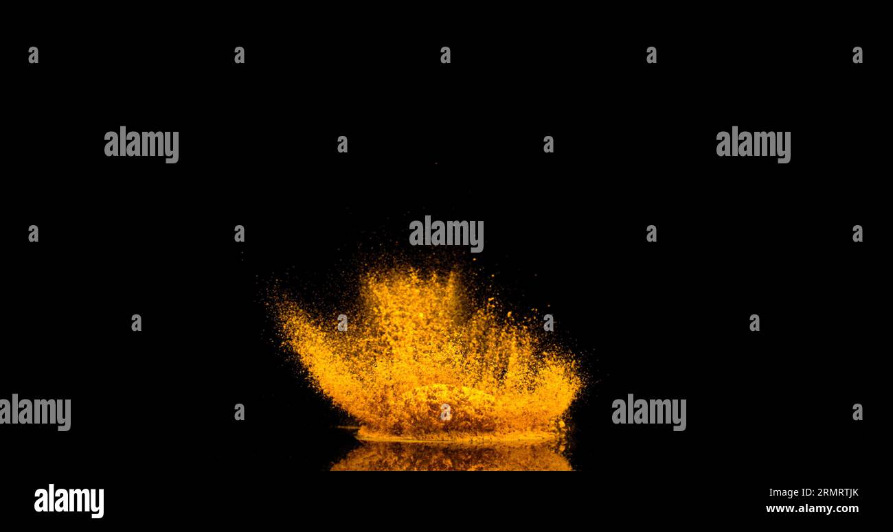 Curry Powder falling against Black Background Stock Photo - Alamy