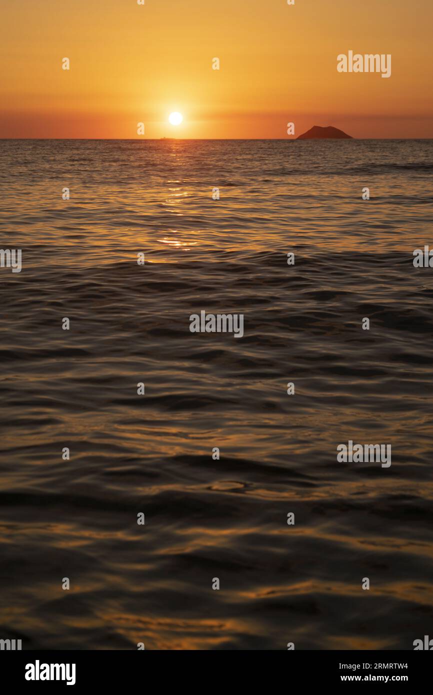 island of volcano seen at sunset from the coasts of calabria Stock ...