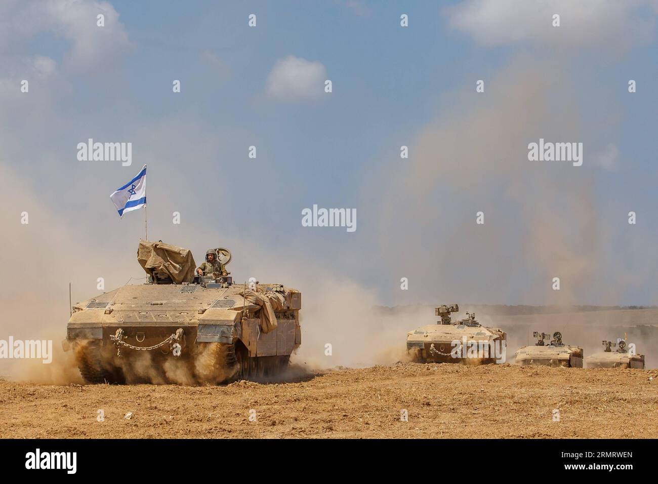 (140805) -- GAZA BORDER, Aug. 4, 2014 -- Israeli military vehicles run ...