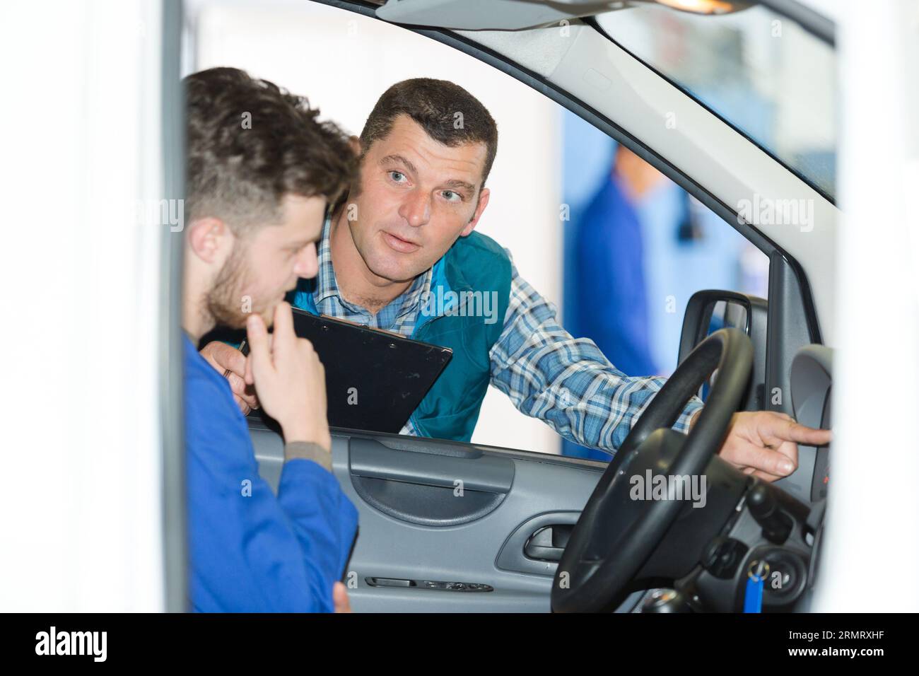 Car mechanic fixing a red car hi-res stock photography and images - Alamy
