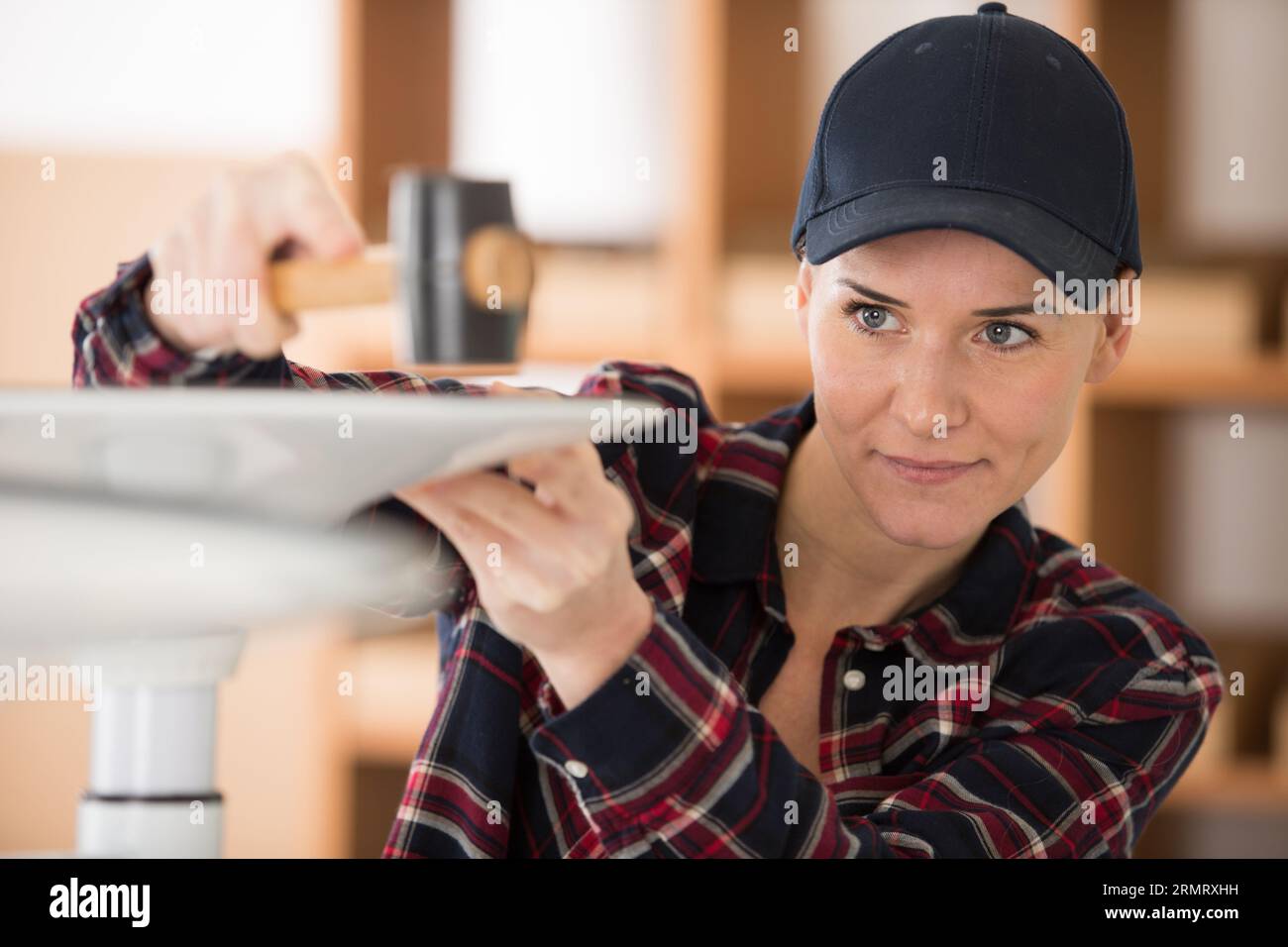 Young woman repairing chair at home hi-res stock photography and images ...