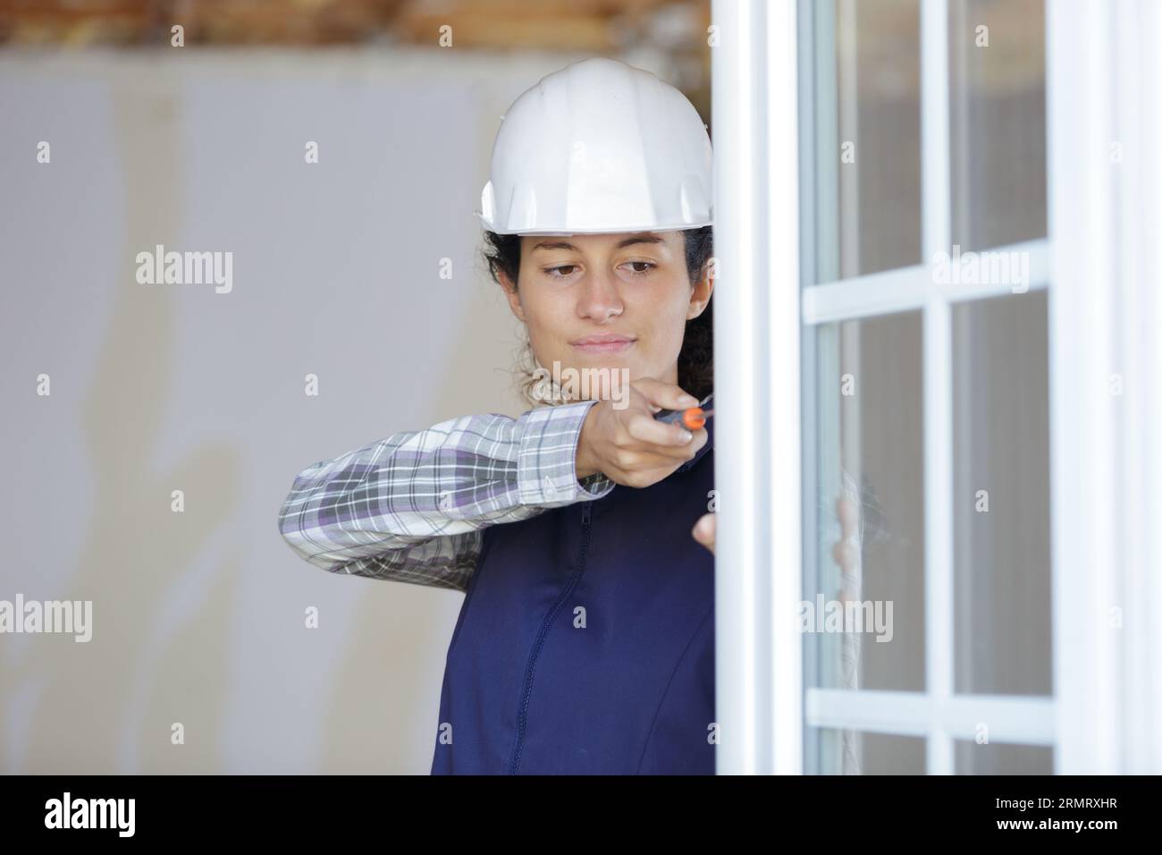 Fixing windows hi-res stock photography and images - Alamy