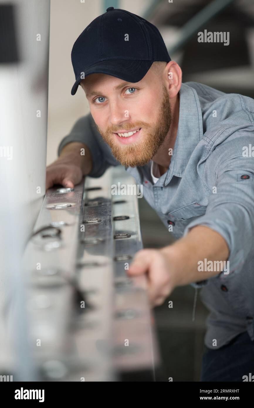 Cheerful male builder carrying hi-res stock photography and images - Alamy