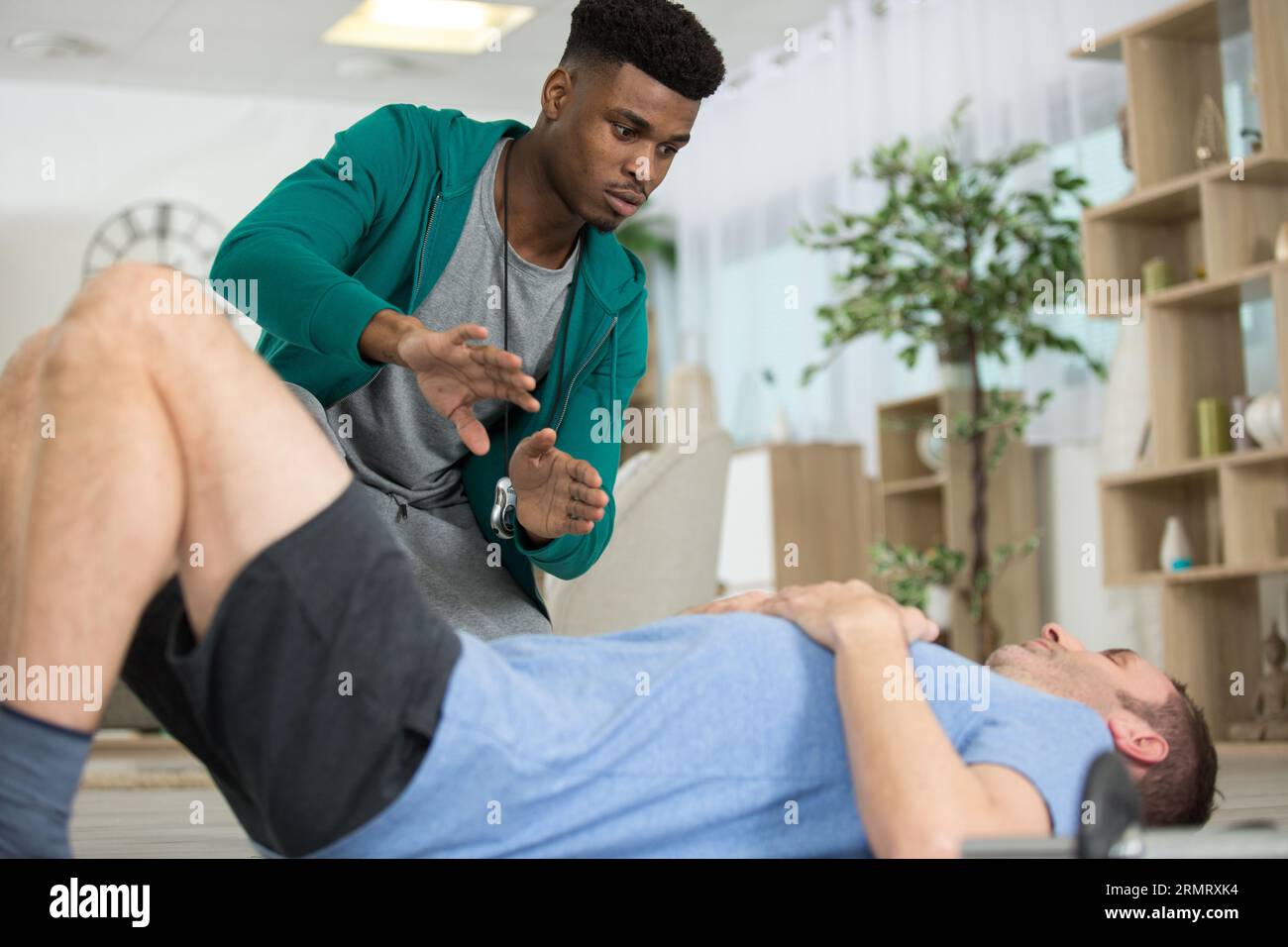 two men doing sport medical training Stock Photo - Alamy