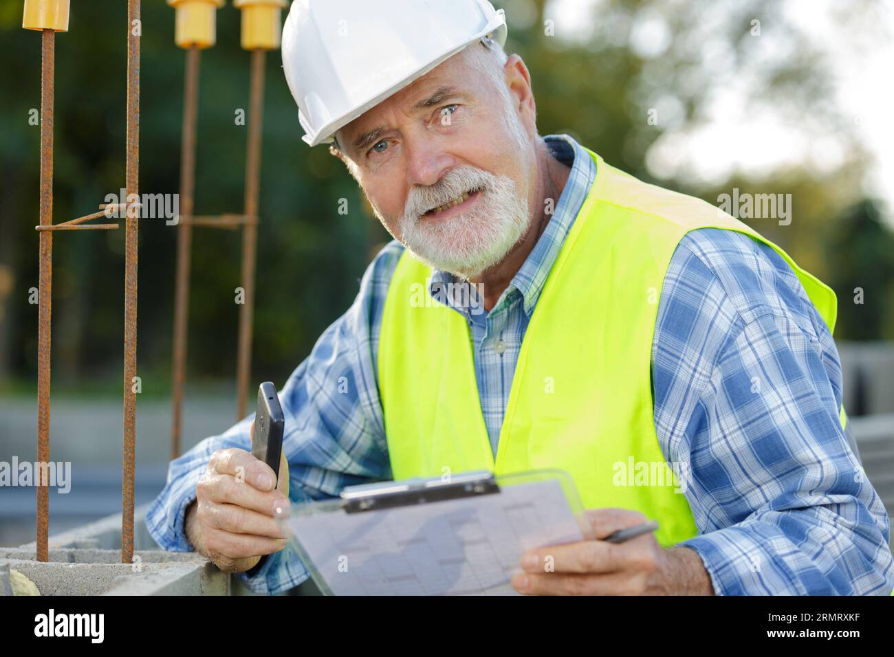 mature male civil engineer wearing protective vest and helmet Stock ...