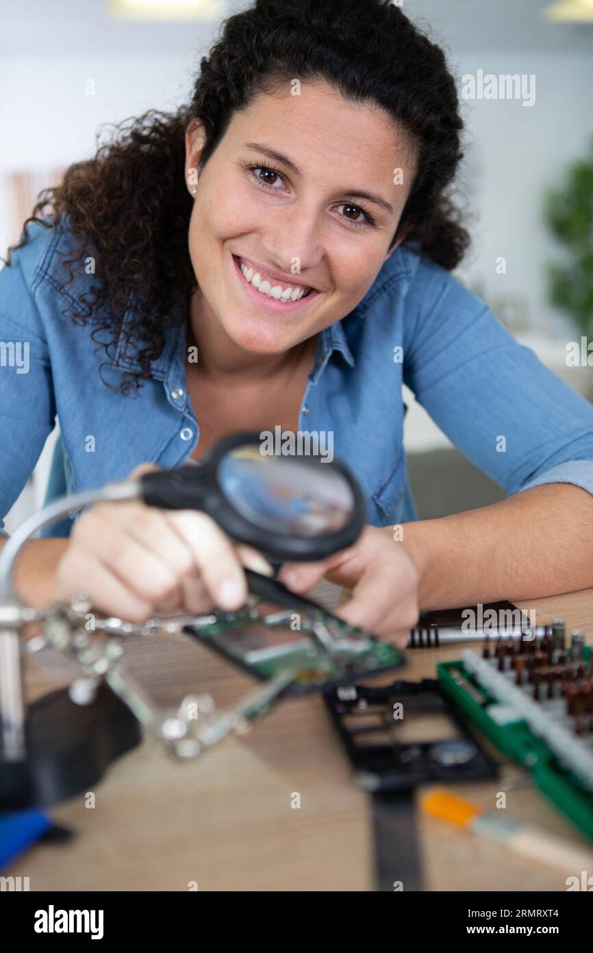 Repairing electronics woman hi-res stock photography and images - Alamy