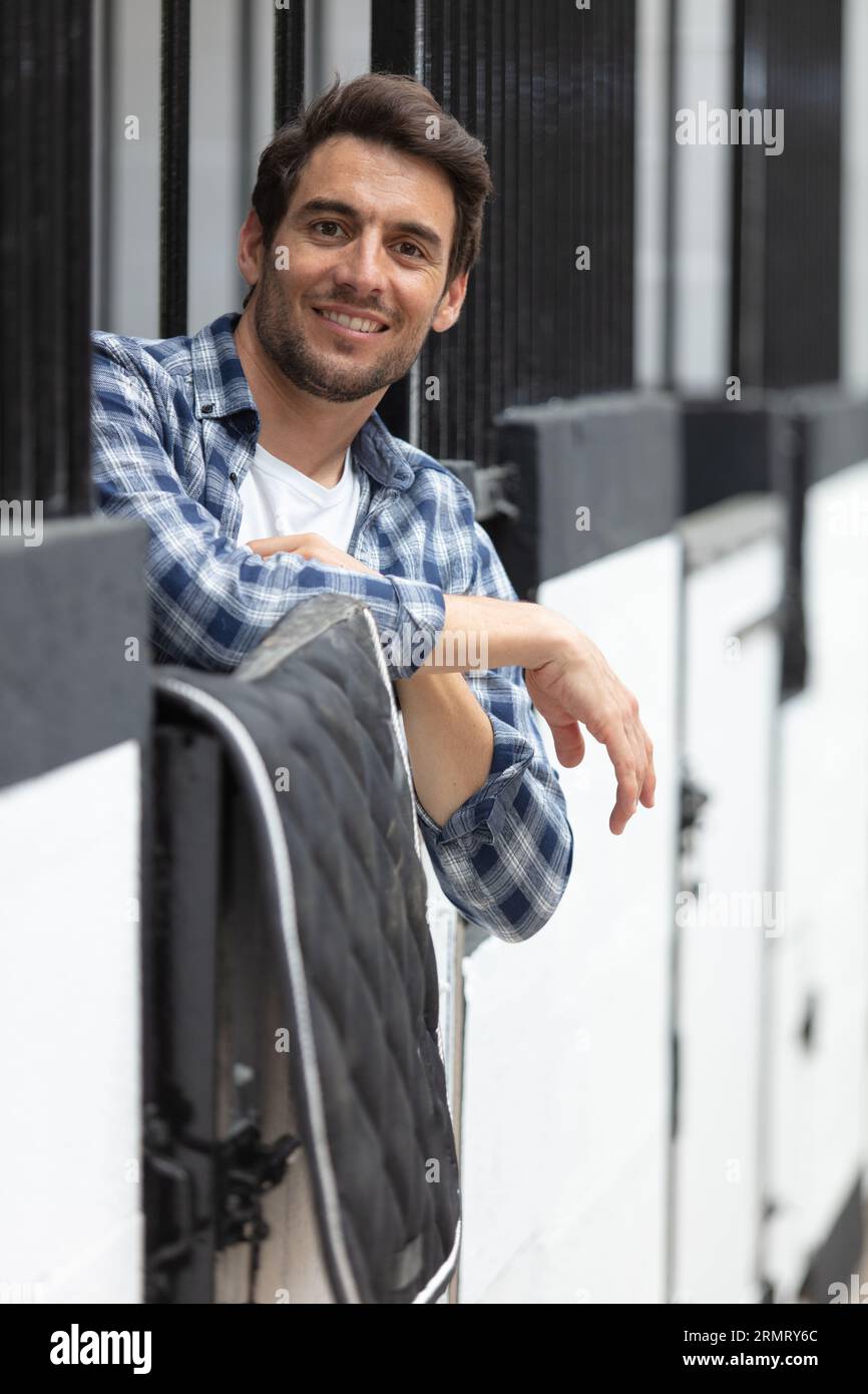 stable boy posing happy in stable Stock Photo - Alamy