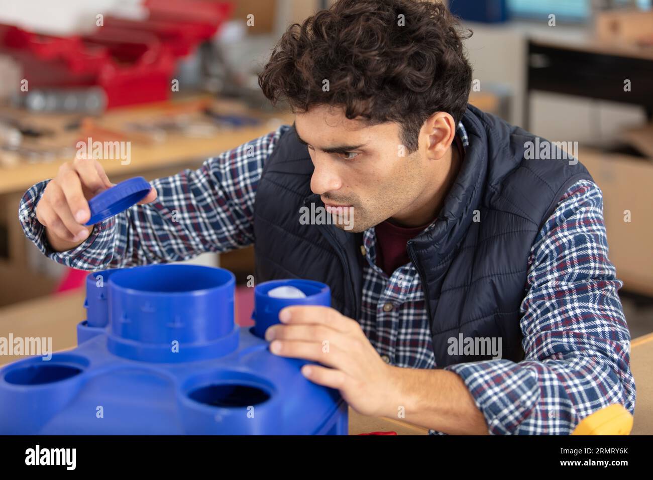 Repairman fixing coffee machine hi-res stock photography and images - Alamy