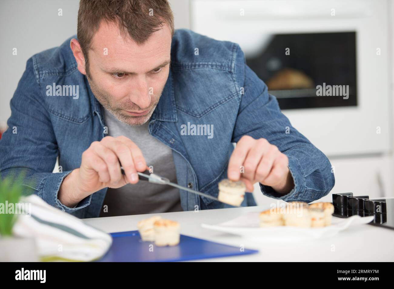 Preparing canapes hi-res stock photography and images - Alamy