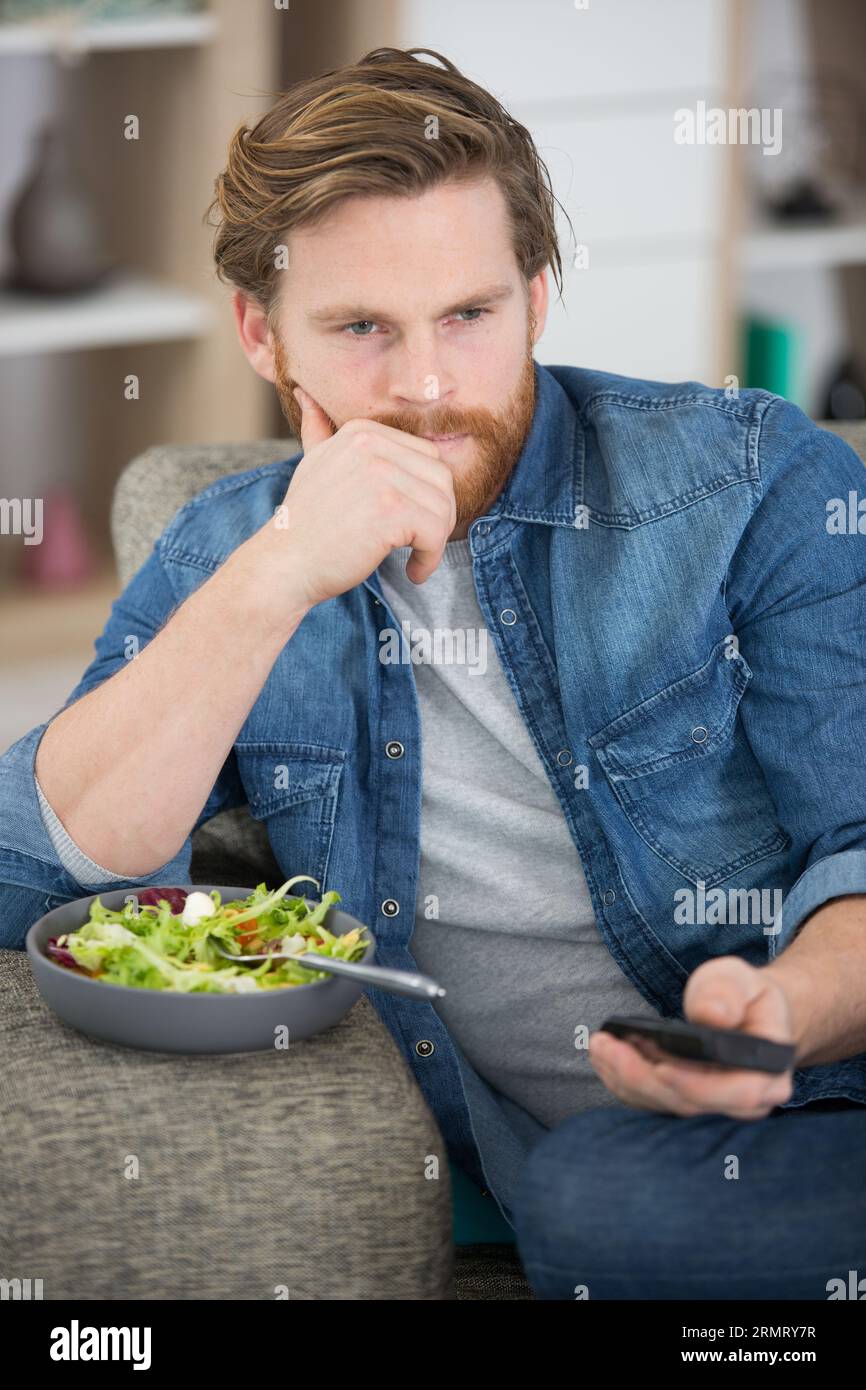 Cooking while watching tv hi-res stock photography and images - Alamy