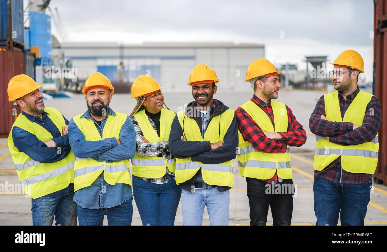 Multiracial workers smiling in fornt of camera while working at ...