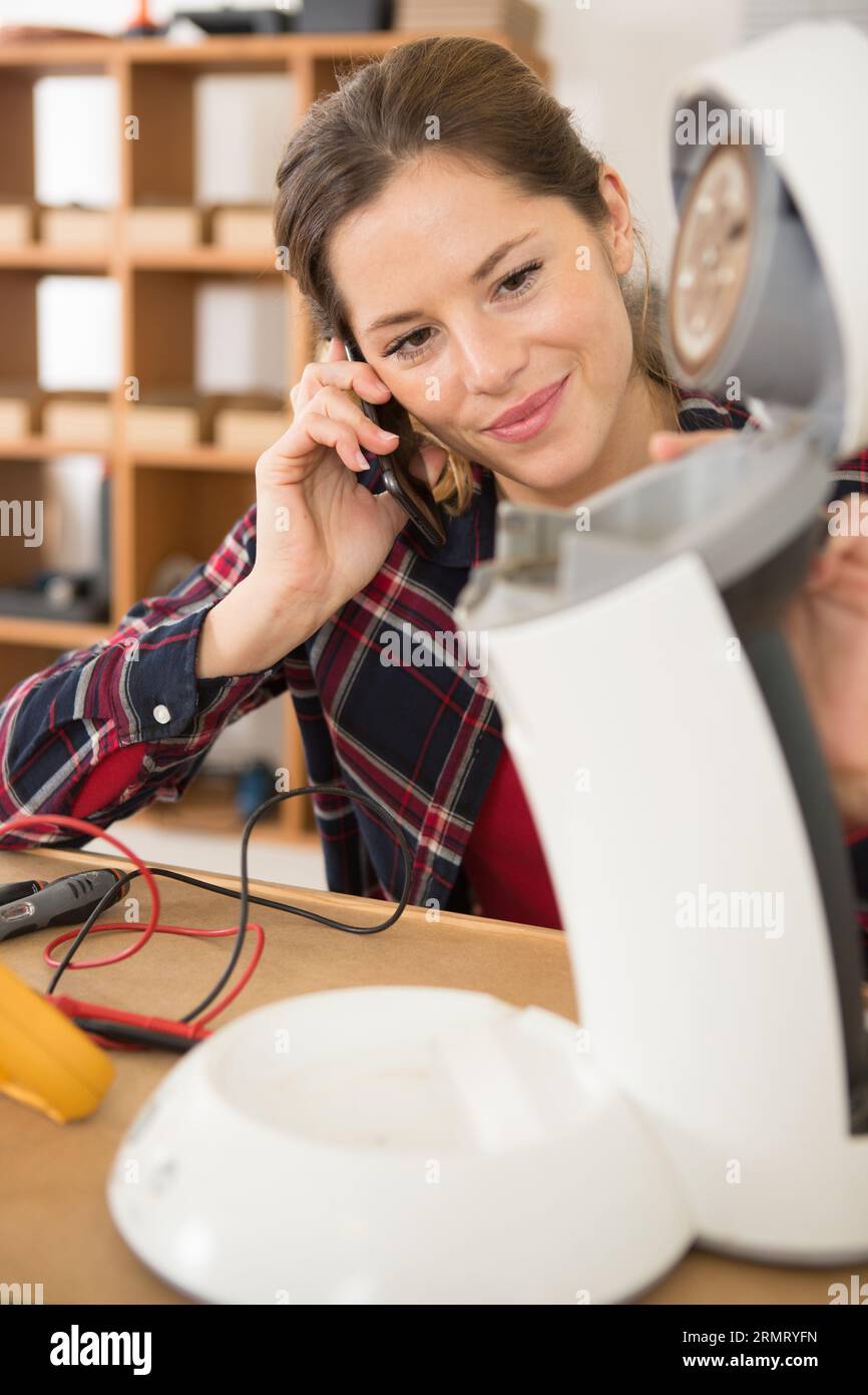 female technician on the phone Stock Photo - Alamy