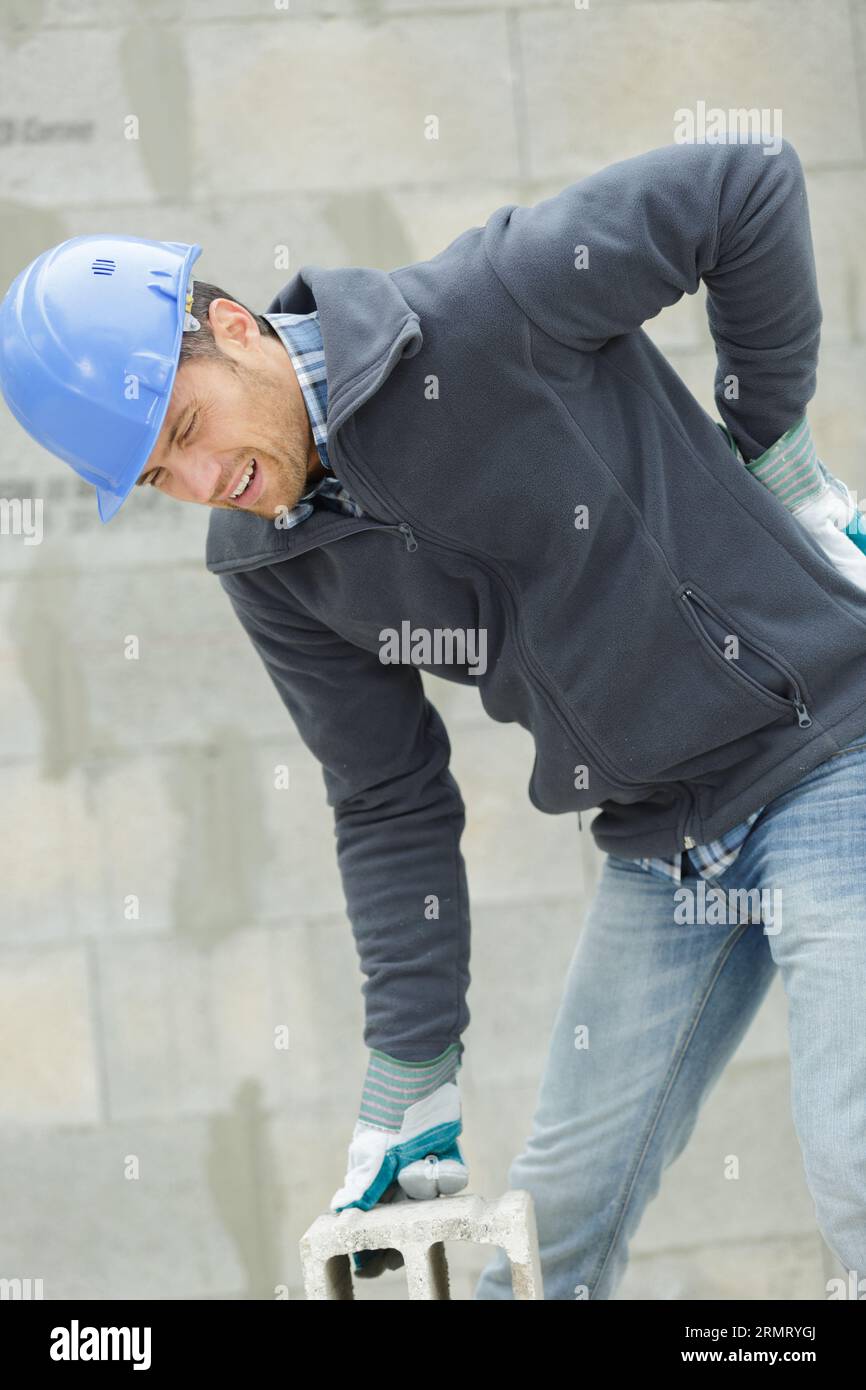 Young man experiencing back hi-res stock photography and images - Alamy