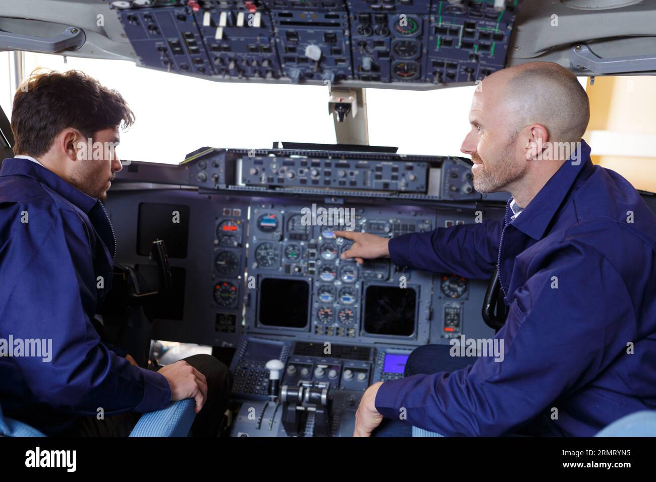 Pilot talking cabin crew hi-res stock photography and images - Alamy