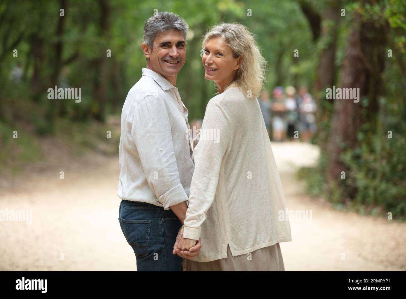 cute middle aged couple embracing outdoors Stock Photo - Alamy