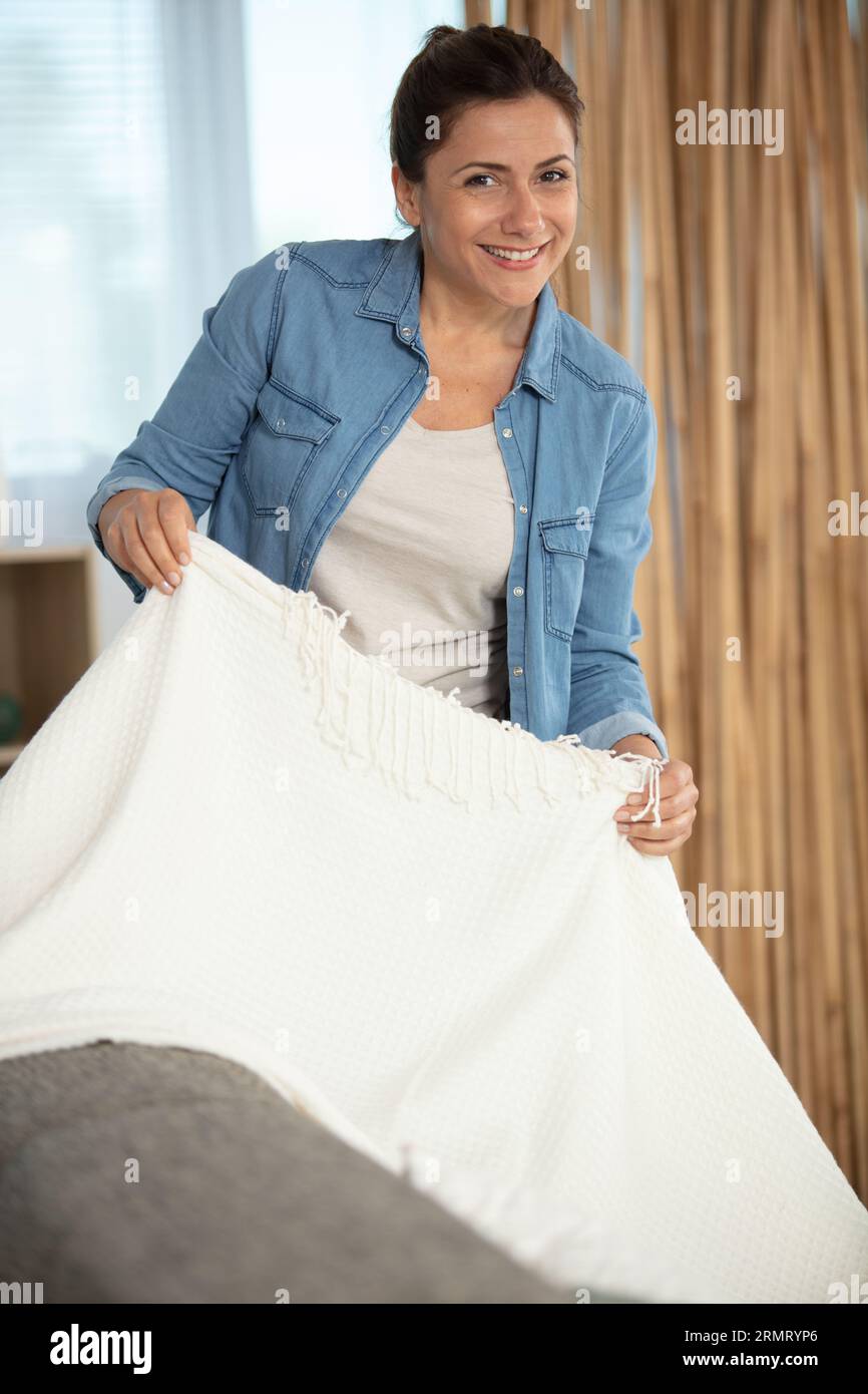 Woman taking off shirt hi-res stock photography and images - Alamy