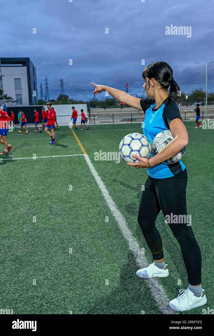 Youth soccer coach, directs daily training Stock Photo - Alamy