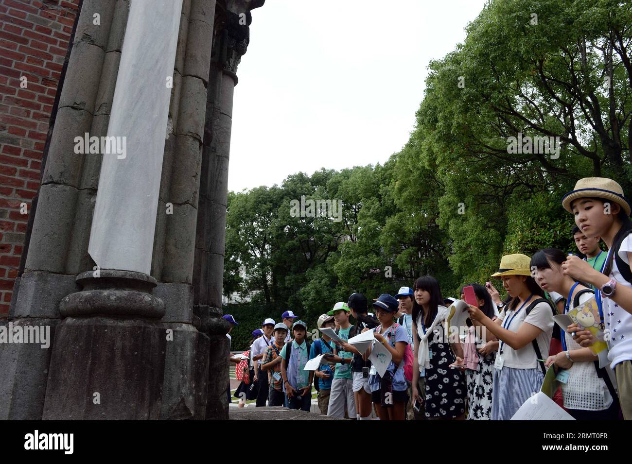People view the remains of a Catholic church after the atomic bombing ...