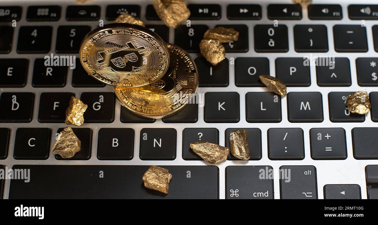 Bitcoins and Gold Nuggets on Computer Keyboard Background Stock Photo ...