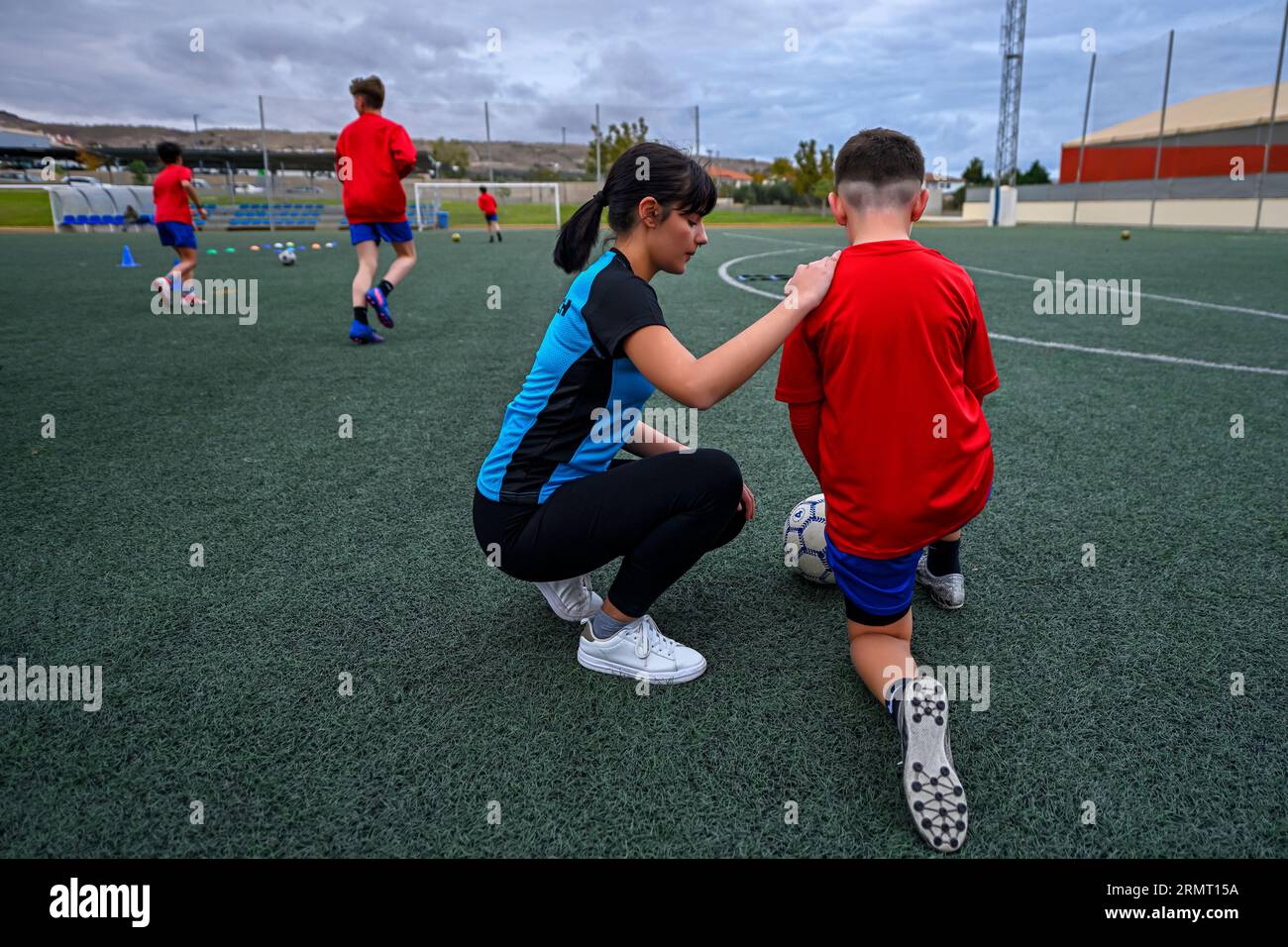 Youth soccer coach, directs daily training Stock Photo - Alamy