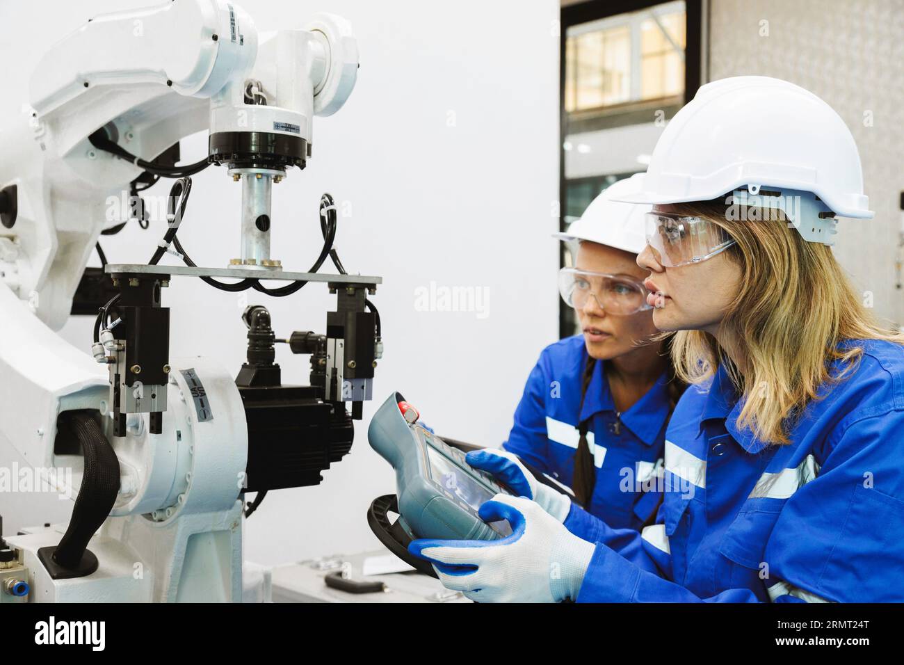 female automation machine engineer student study and inspection control ...