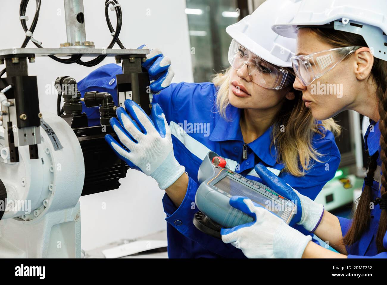 female automation machine engineer student study and inspection control ...