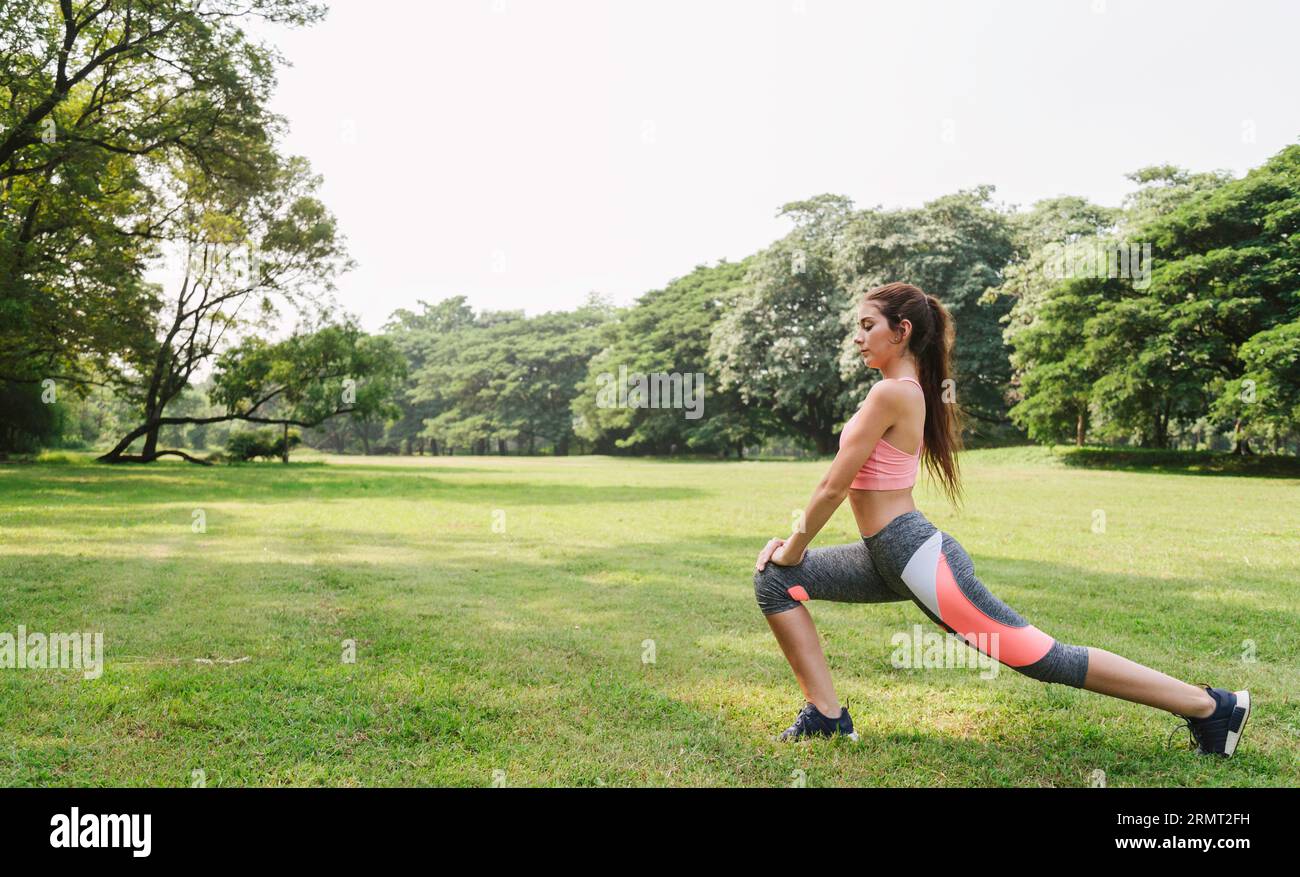 Sports Woman Working Out And Stretching Warm Up Leg Muscle Before