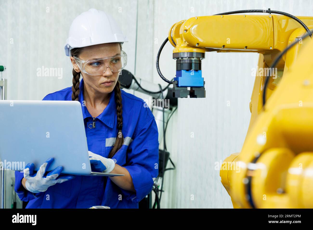 female automation machine engineer student study and inspection control ...