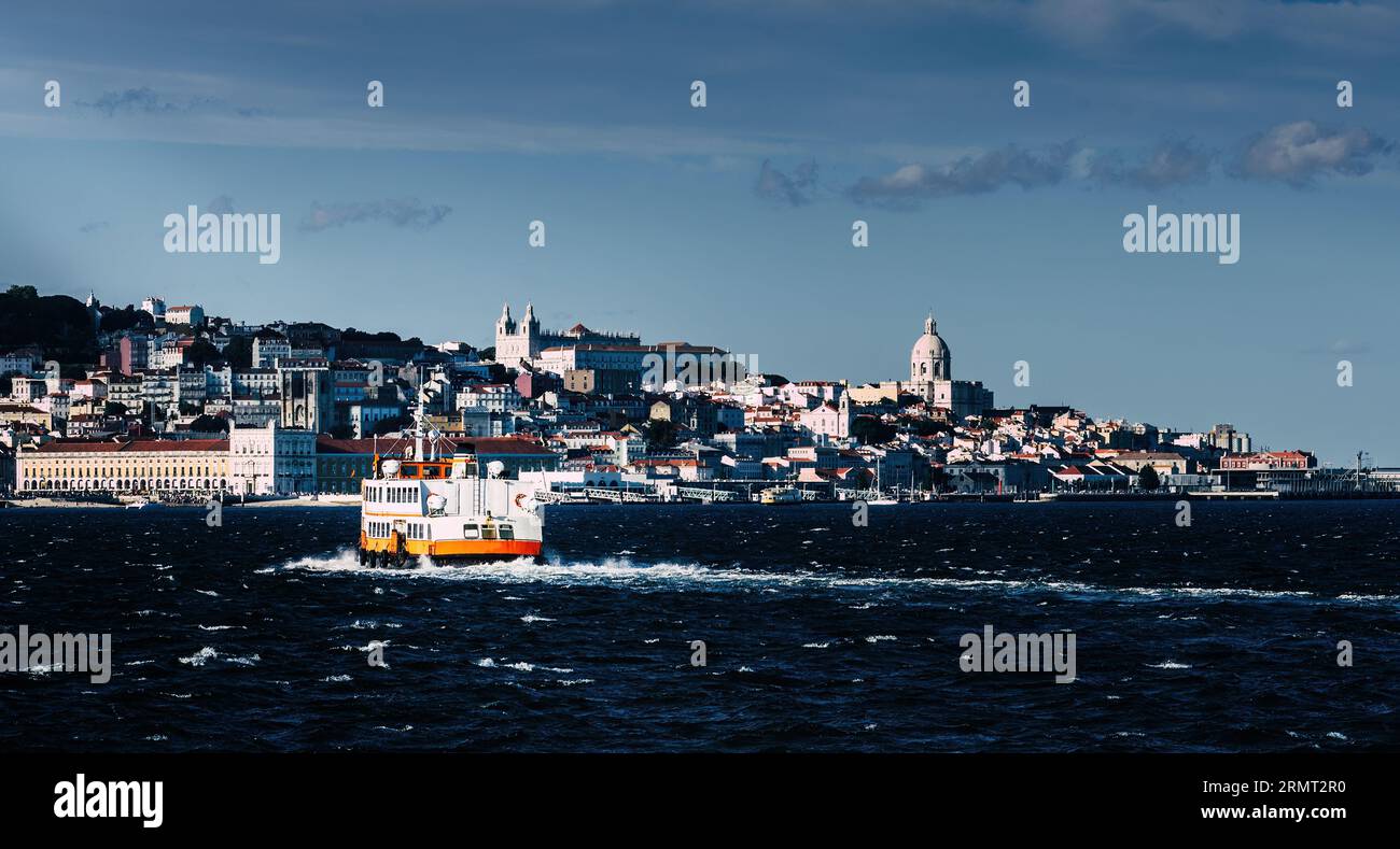 Lisbon skyline with ferry boat as seen from Cacilhas in Almada ...