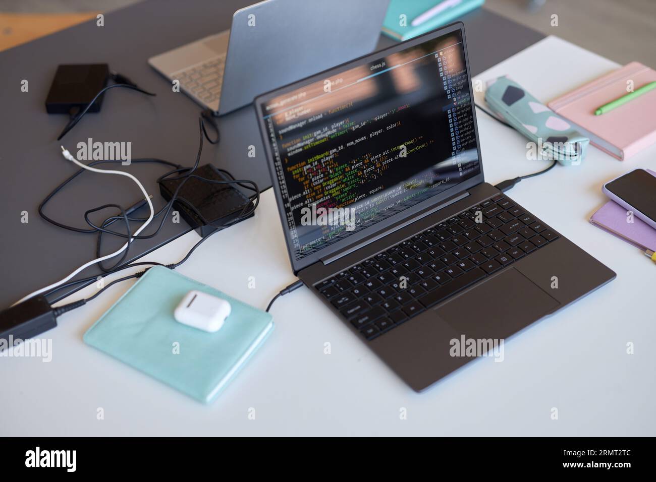 Above angle of wireless computer with coded data on screen surrounded ...