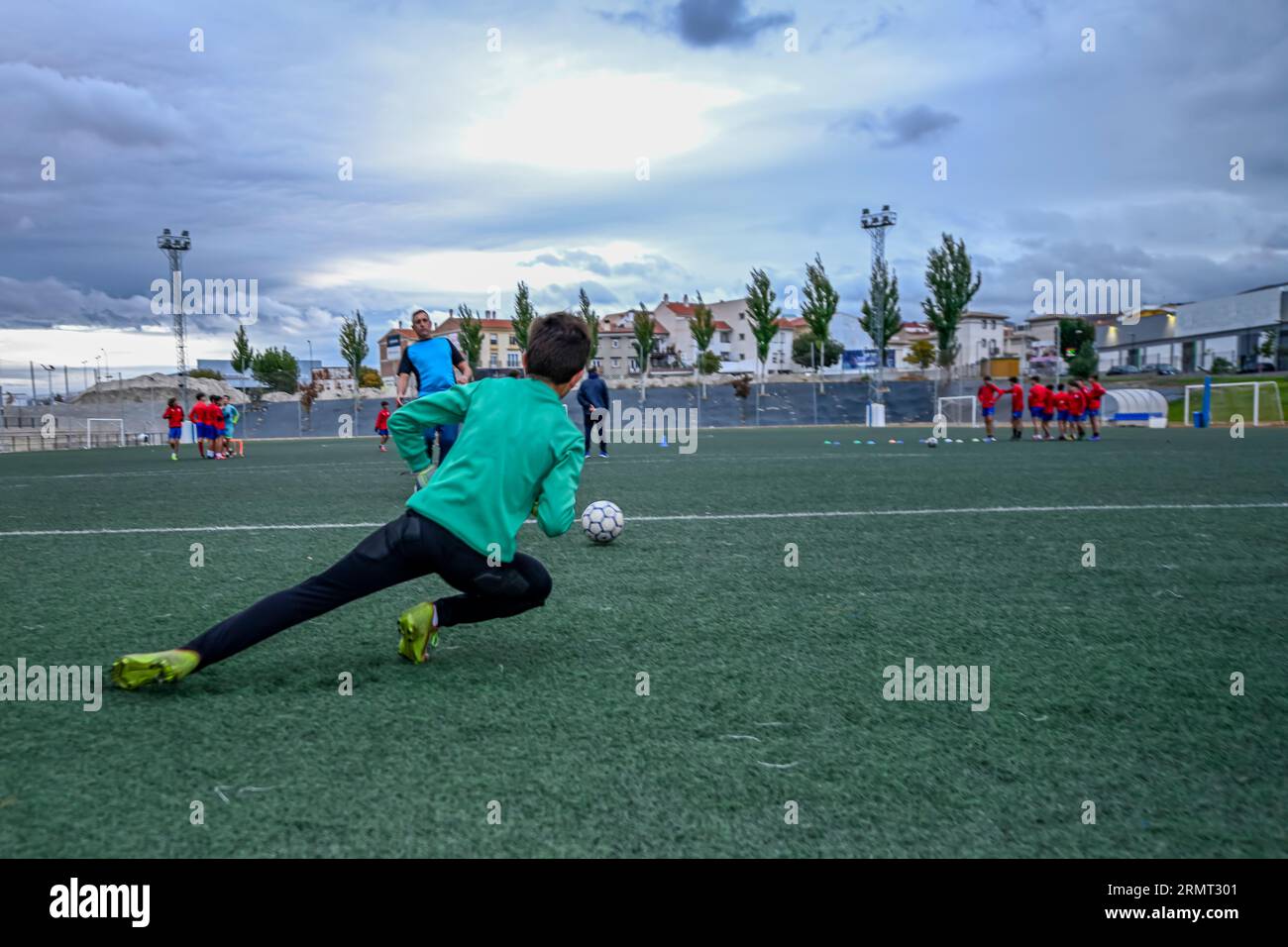 Goalkeeper of a soccer team, playing on the field Stock Photo - Alamy