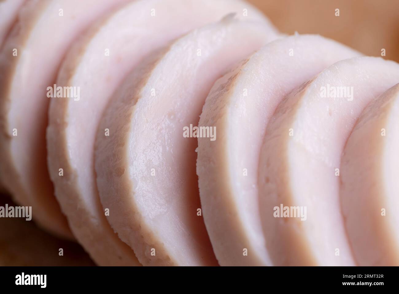 Sliced round-shaped ham from chicken meat, freshly sliced chicken ham ...