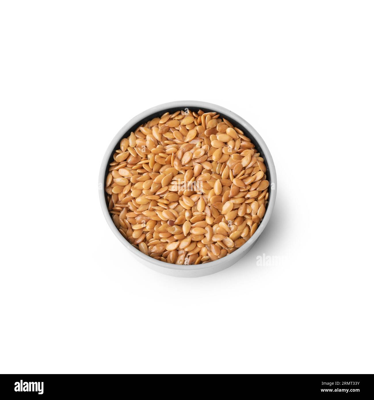 Golden Flax Seeds In White Bowl Top View Isolated On White Background