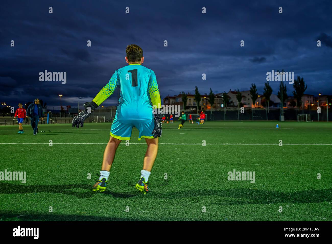 Goalkeeper of a soccer team, playing on the field Stock Photo - Alamy