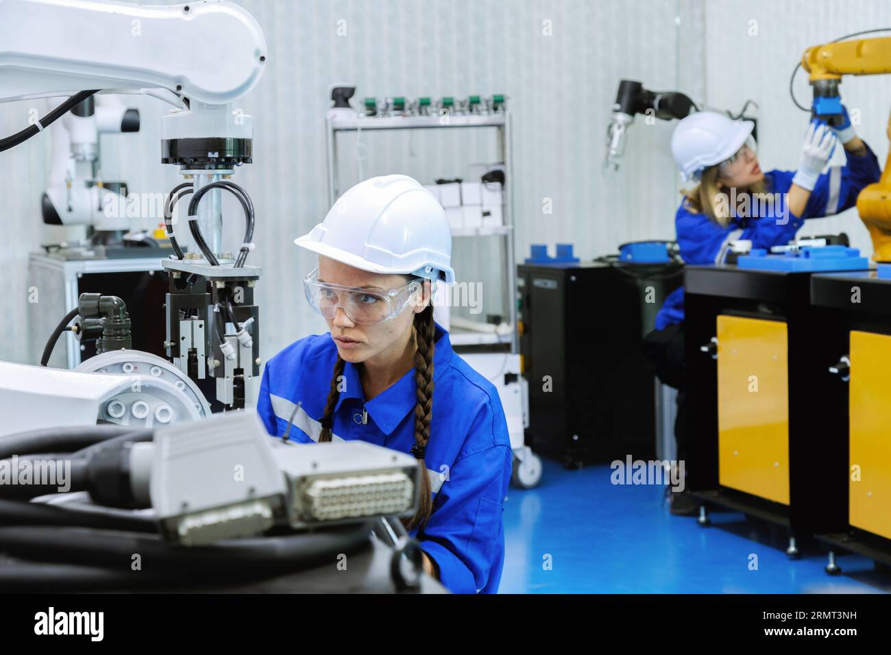 female automation machine engineer student study and inspection control ...