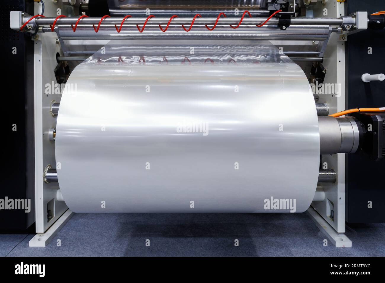 roll of plastic packaging film on the automatic packing machine in food ...