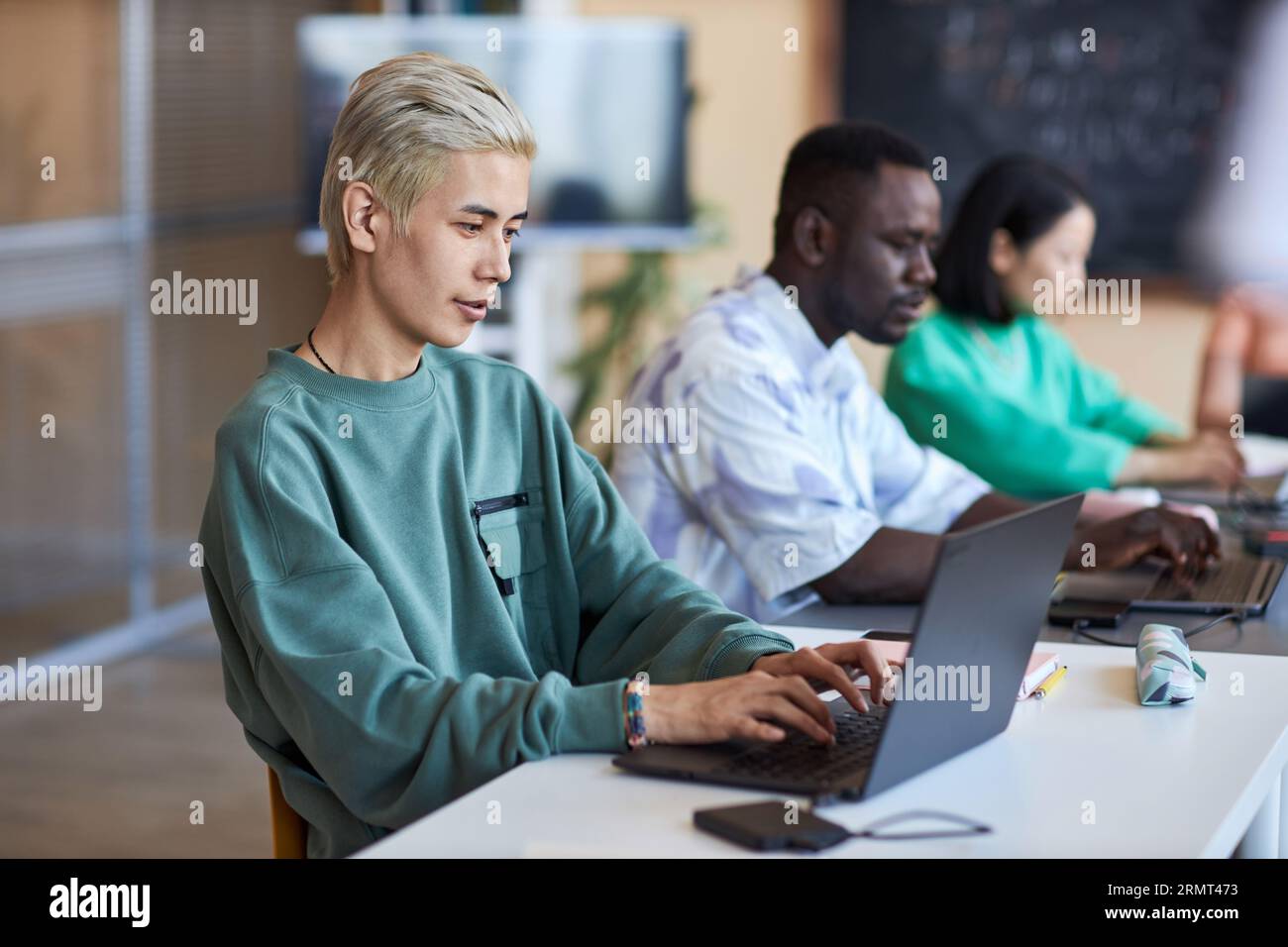 Side view young intercultural hi-res stock photography and images - Alamy