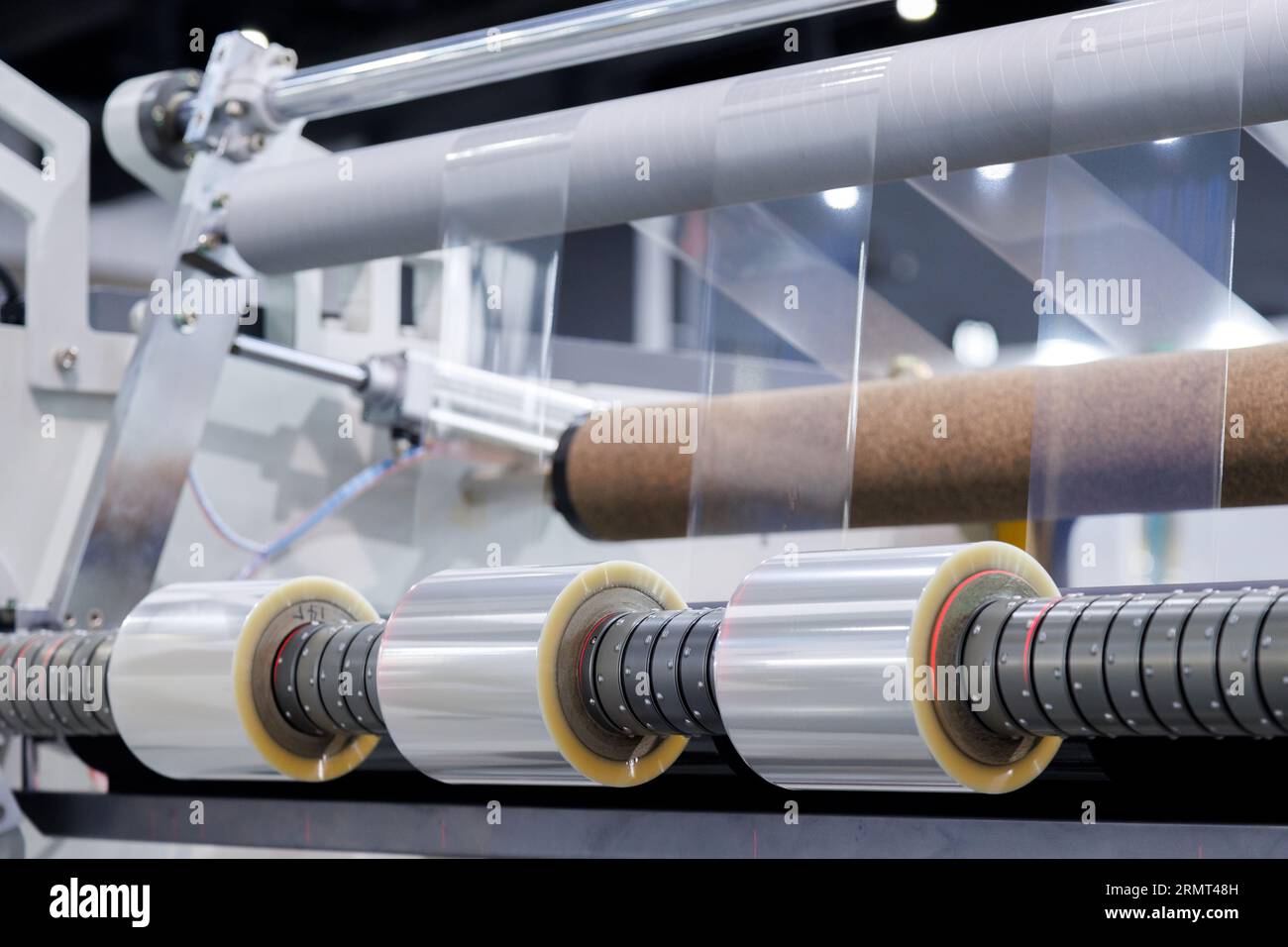 roll of plastic packaging film on the automatic packing machine in food ...